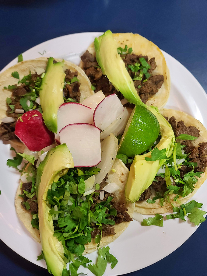 These street-style tacos come dressed for success with fresh cilantro, radish, and avocado – the holy trinity of taco toppings that elevate every bite.