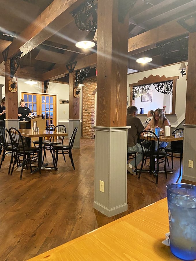 Exposed beams, brick walls, and that warm glow—dining rooms like this make you want to linger like it's Sunday dinner at Grandma's.