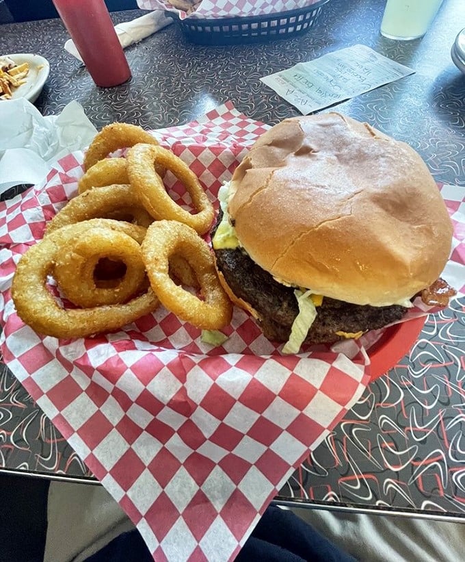 This isn't just a double bacon cheeseburger—it's architecture. Frank Lloyd Wright would weep at the structural perfection of these stacked layers.
