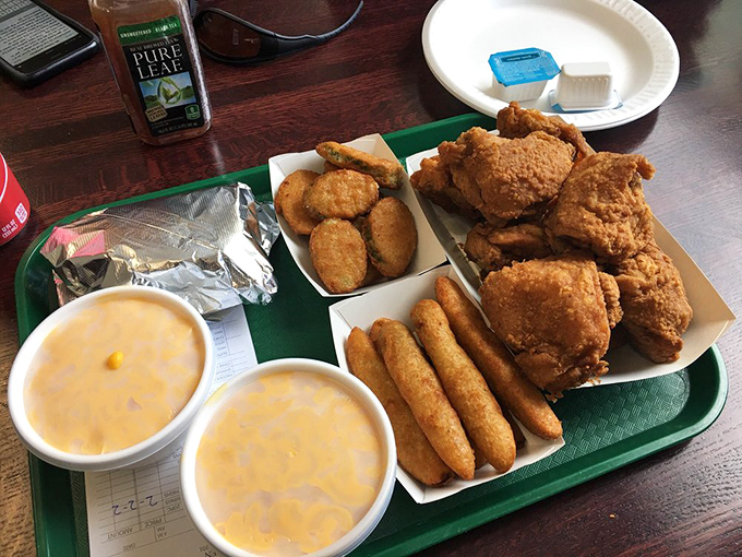 A feast fit for royalty served on a humble cafeteria tray—chicken, mozzarella sticks, and mac and cheese that whisper, "Diet? What diet?"