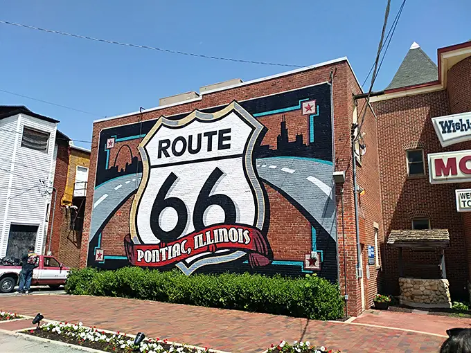 Route 66 isn't just painted on this wall—it's embedded in Pontiac's DNA, a roadside attraction that actually lives up to the billboards.
