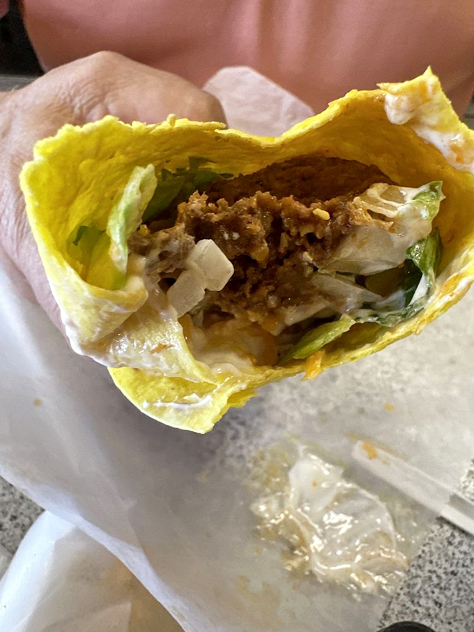Behold the Sancho—a soft yellow tortilla cradling seasoned beef, crisp lettuce, and cool sour cream. Simplicity that somehow tastes like a celebration.
