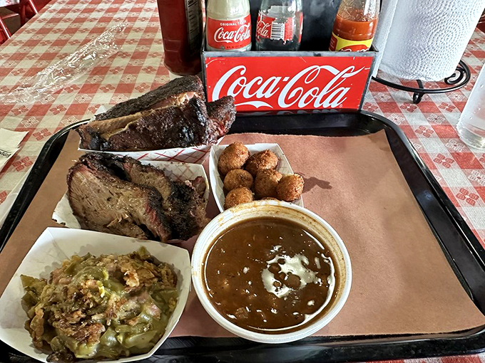 Meat and three sides isn't just a meal—it's a Southern handshake. That brisket's smoke ring is like nature's way of saying "you're welcome."