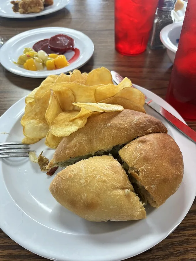 This sandwich with house-made chips isn't just lunch – it's edible Midwest heritage served on bread that puts store-bought to shame.