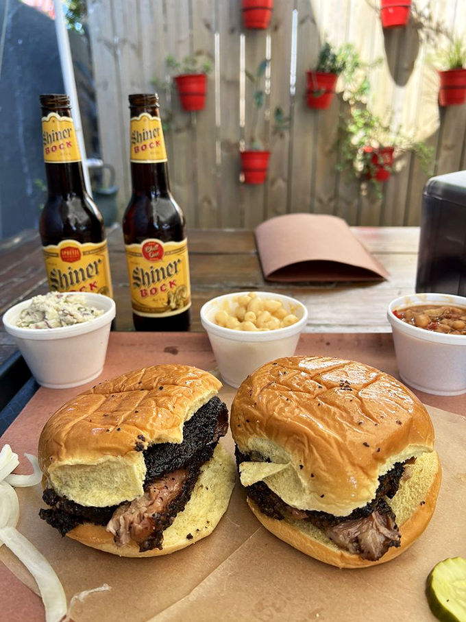Brisket sandwiches and cold beer—proof that sometimes the simplest pleasures are life's greatest achievements. Those sides aren't supporting actors; they're co-stars.