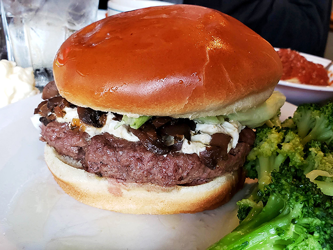 Not just any burger—this is what happens when steak experts decide to play between two buns. The broccoli's just there for moral support. 
