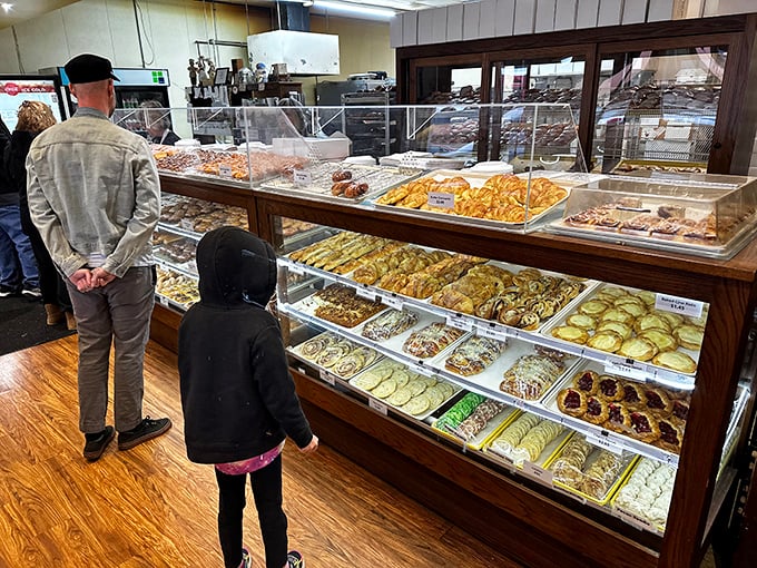 The universal language of anticipation: customers contemplating life's most important question – "How many donuts is too many donuts?"