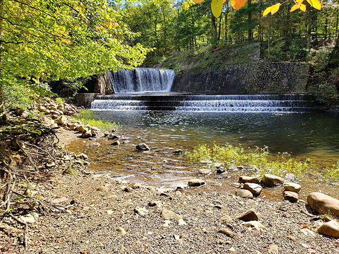 Water doesn't just flow here—it performs, cascading down CCC-built stone steps like nature's own version of the Bellagio fountains.