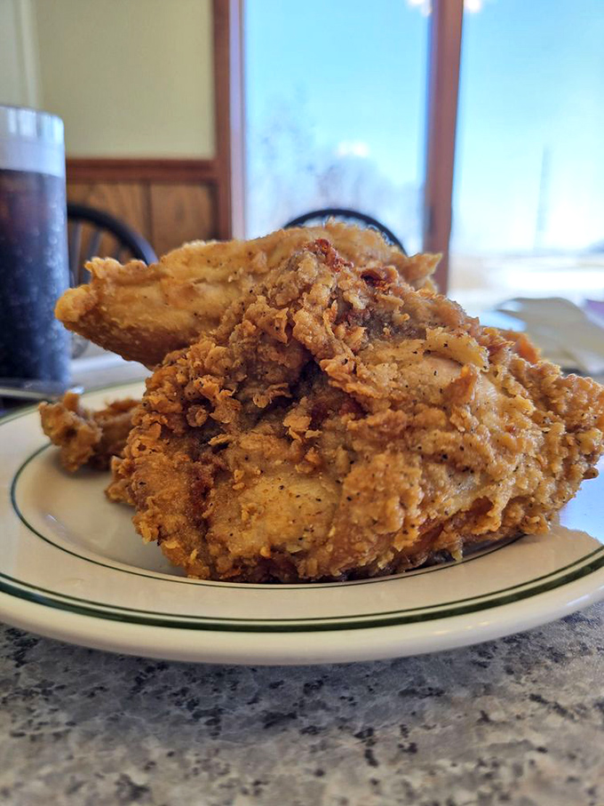 This isn't just fried chicken; it's edible armor—gloriously crunchy outside, tender within, and worth every napkin you'll need afterward.