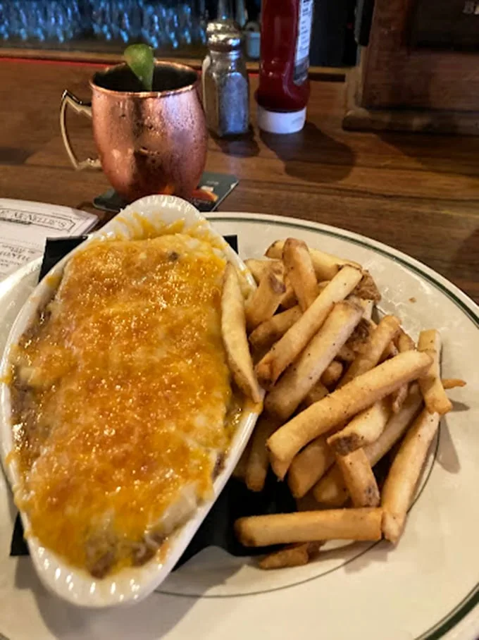 Comfort food royalty: McNellie's shepherd's pie with a side of perfectly crisp fries—because sometimes your soul needs carbs in stereo.