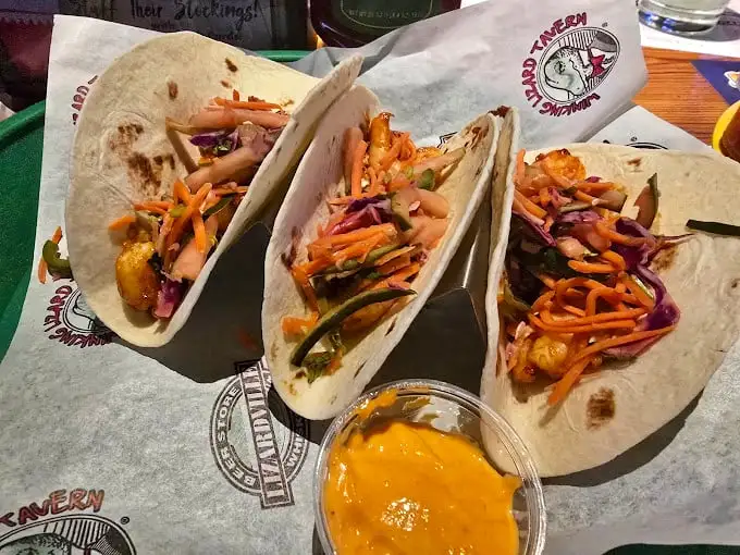 Tacos that don't just talk the talk—they walk the flavor walk. That sauce cup isn't optional; it's your ticket to taste paradise.