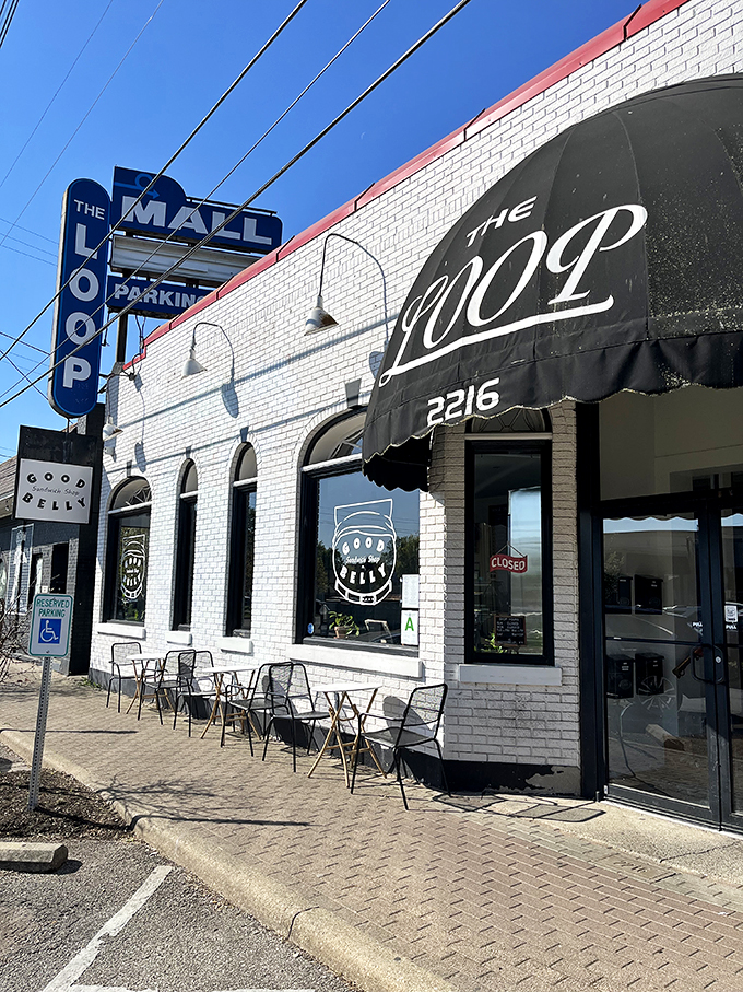 White brick, black awnings, and "The Loop" sign – Good Belly's street presence has that perfect "neighborhood gem" quality.