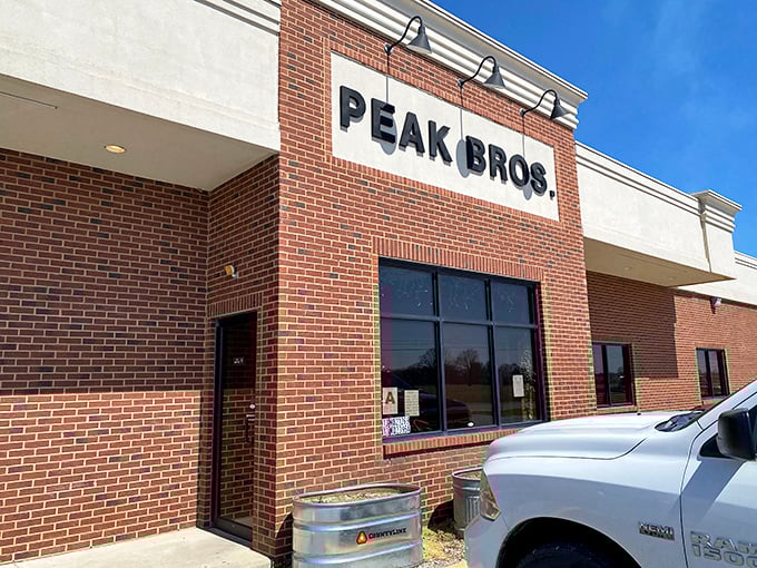 Peak Brothers' brick façade screams "no-nonsense BBQ inside." When simplicity meets smoke, magic happens on your plate!