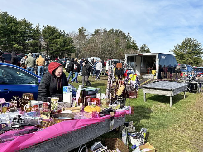 Treasure hunters scan the horizon at Rietta, where tables of possibilities await under the watchful gaze of central Mass forests.