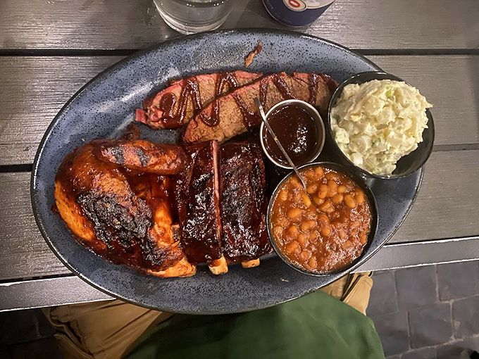 The three-meat platter doesn't just feed you—it transforms your entire outlook on life, making you wonder why you ever wasted time eating anything else.