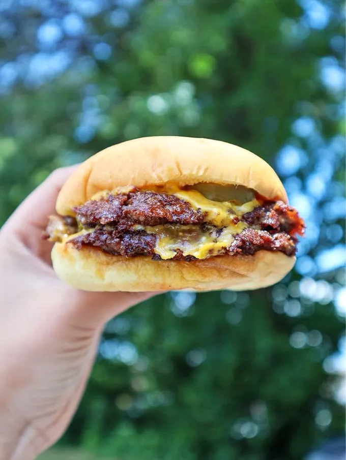 Simple perfection: a burger with those magical crispy edges where the patty meets the griddle. No filter needed when reality looks this delicious.