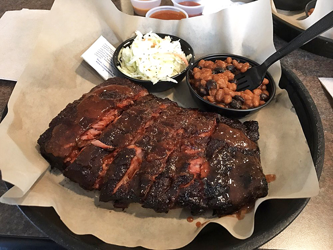 The kind of ribs that make conversation impossible, replaced by appreciative grunts and the occasional "Oh my God." Worth every napkin you'll need.