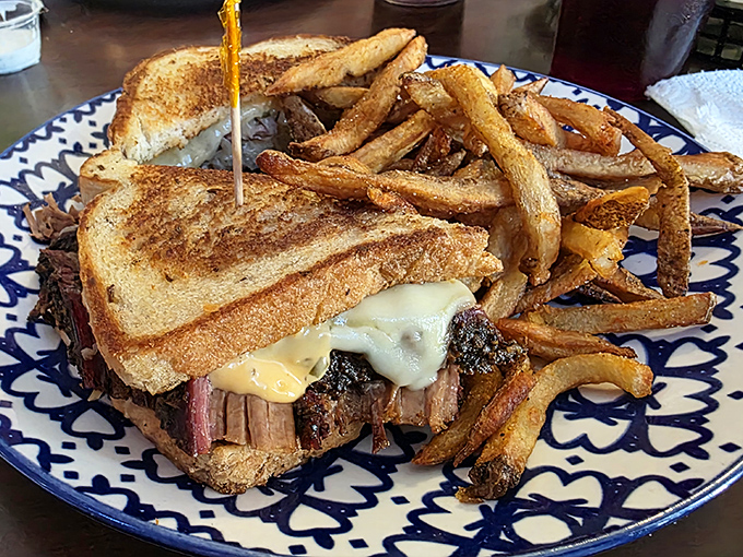 This brisket sandwich isn't just lunch—it's architectural genius with layers of smoke-kissed beef, melted cheese, and golden toast.