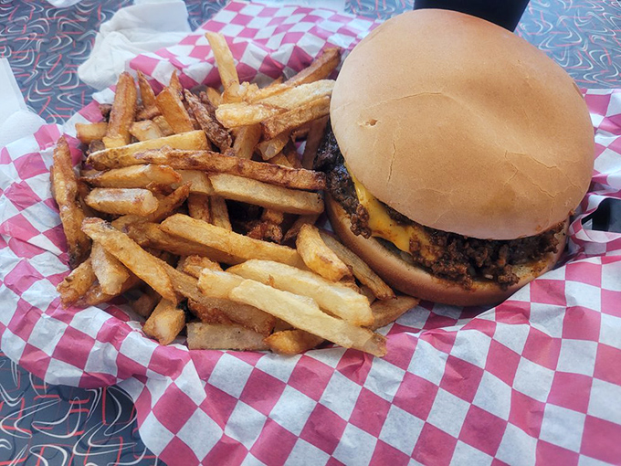 The classic American duo—burger and fries—performing their greatest hits on a red and white checkered stage.
