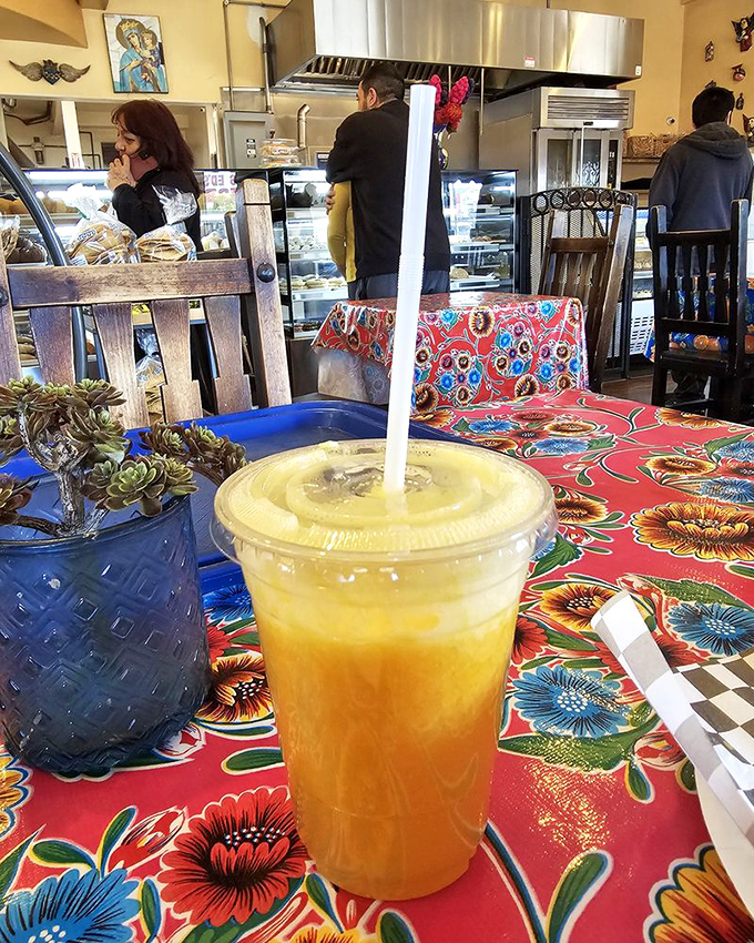 That fresh orange juice isn't just a beverage – it's liquid sunshine in a cup, sitting pretty on tablecloths that could outshine a rainbow.