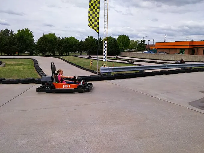 The look of pure concentration says it all – these kids aren't just driving, they're plotting racing dynasties.