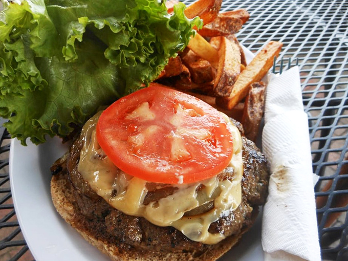 This isn't just a burger—it's a masterpiece of melty cheese, fresh tomato, and perfectly grilled beef that would make even kangaroos hop with joy.