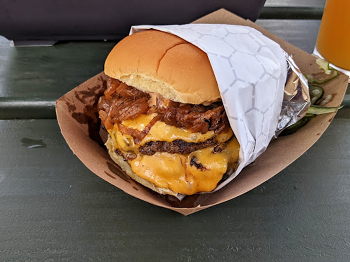 The burger that launched a thousand return visits. Melty cheese cascades down perfectly seasoned patties like a waterfall of deliciousness.