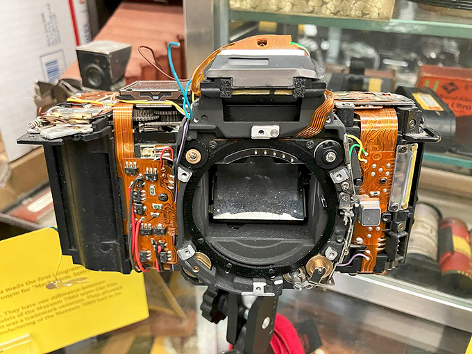 Peek inside a modern camera and you'll find this fascinating tangle of circuits and wires—photography's evolution from mechanical to digital laid bare.