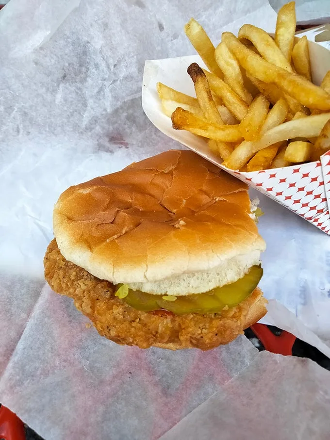The chicken sandwich arrives like a crispy golden postcard from the land of "They Don't Make 'Em Like This Anymore."