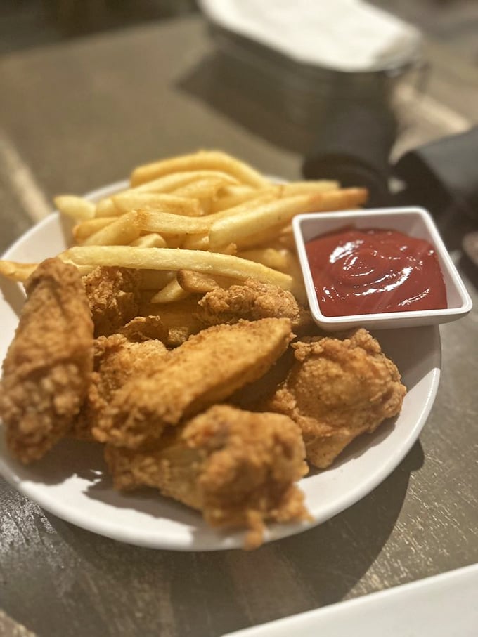 Southern comfort meets culinary finesse. These golden strips of chicken pair perfectly with hand-cut fries and that tangy sauce for dipping.