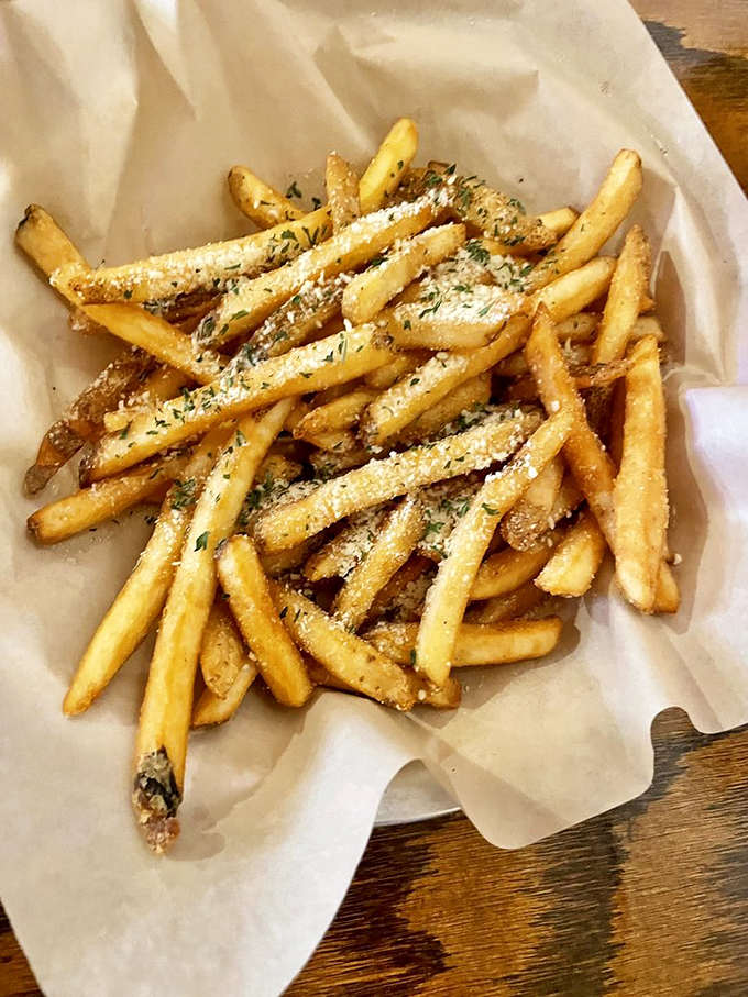 These aren't ordinary fries—they're golden treasures dusted with parmesan and herbs. Each crispy bite is a reminder that simple pleasures are often the most profound.