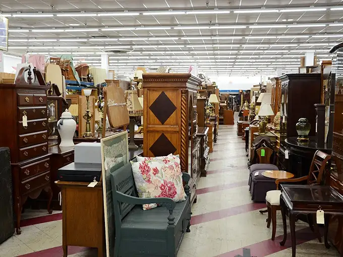 Where vintage furniture dreams are made and storage unit nightmares begin—each piece silently promising it would look perfect in that corner of your living room.