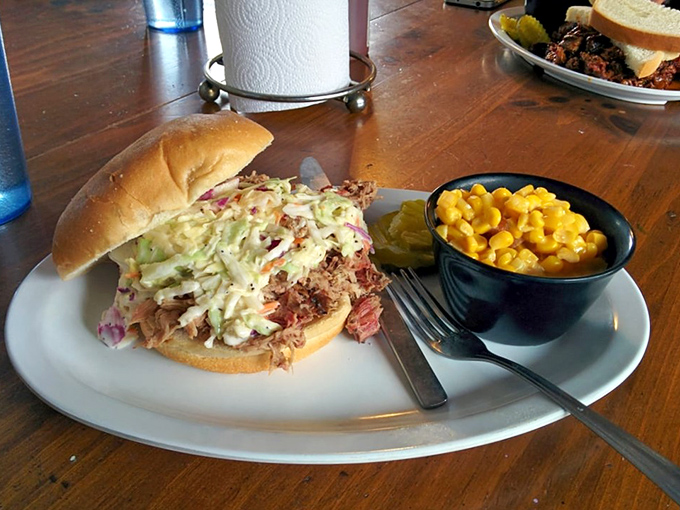 The pulled pork sandwich—where coleslaw and meat perform a beautiful dance. It's like a barbecue hug between two pieces of bread.