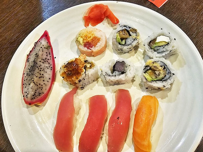Sushi artistry that would make a Japanese master nod in approval. That dragon fruit slice adds the perfect touch of color to this edible masterpiece.