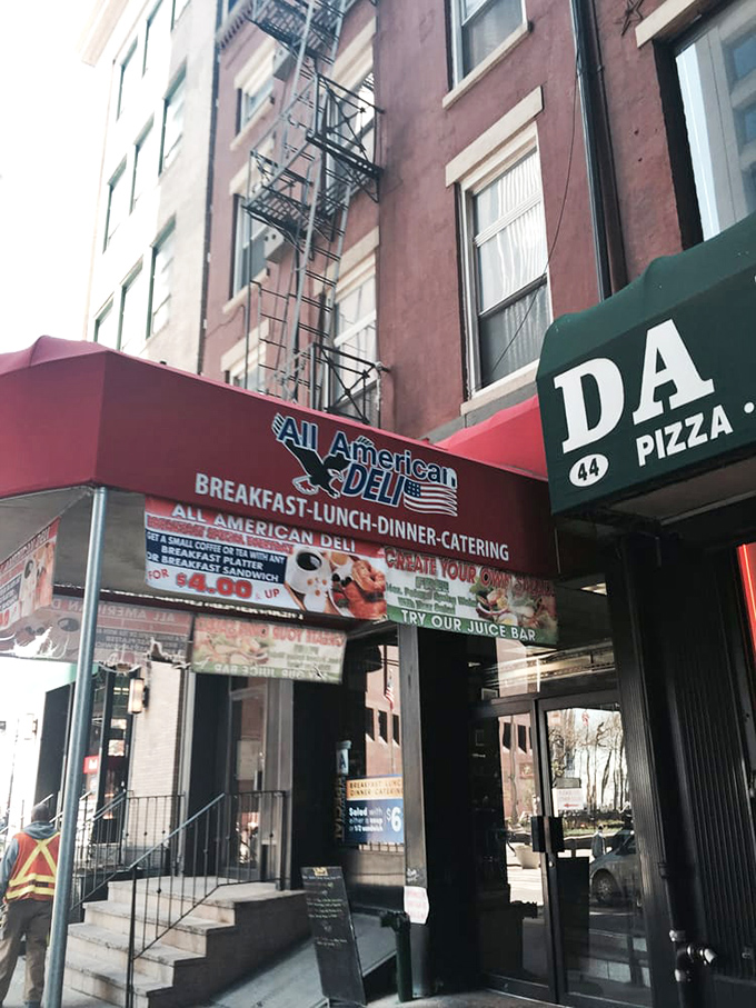 All American Deli's no-nonsense awning cuts through the noise – breakfast, lunch, dinner, done.