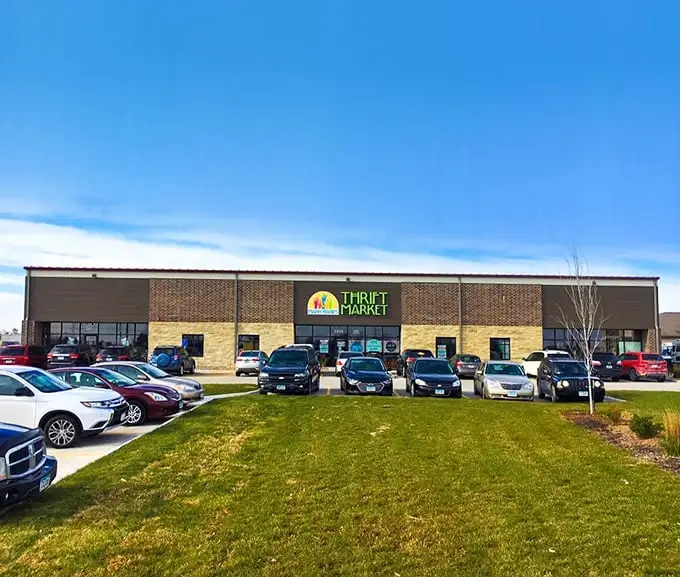Many Hands Thrift Market's colorful logo says it all. A rainbow of bargains awaits inside this modern thrifter's paradise.