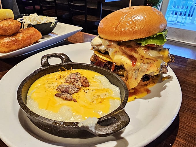 This burger isn't just a meal—it's a declaration of deliciousness with a side of bubbling cheese grits that would make a Southerner weep.