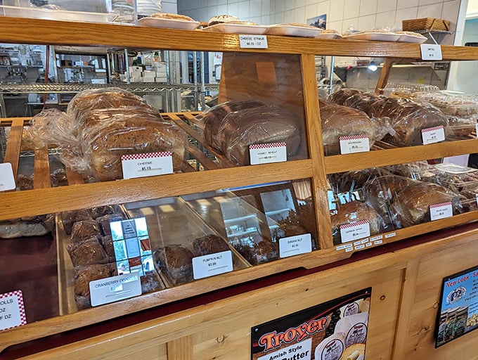 The bread display—where carb-counting goes to surrender. Each loaf sits proudly like it knows it's about to be the best part of someone's day.