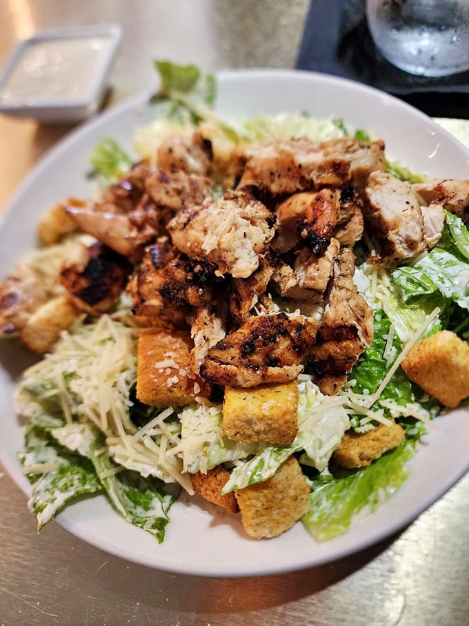 Salad skeptics, prepare to be converted. Perfectly grilled chicken atop crisp romaine with all the classic Caesar trimmings—a meal that satisfies without apology.