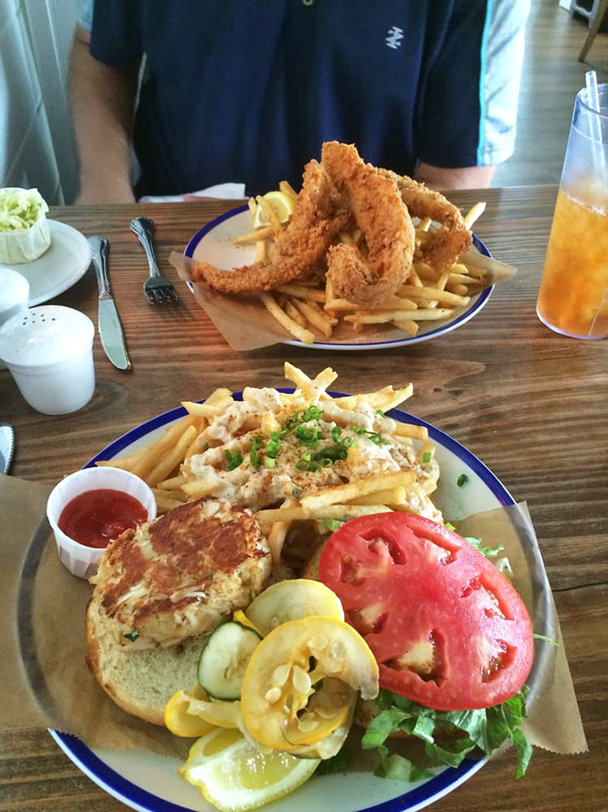 A crab cake sandwich that passes the Maryland border test – minimal filler, maximum flavor, and fries dusted with what must be seafood fairy dust.