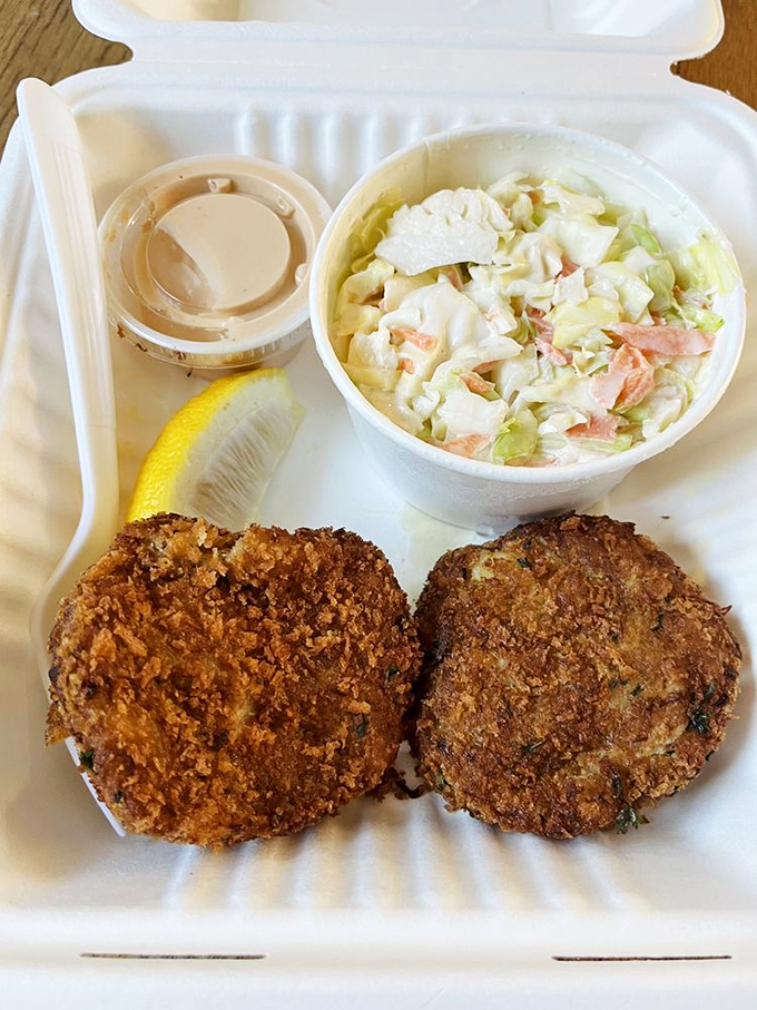 These golden-brown crab cakes aren't just fried—they're elevated. Paired with that creamy coleslaw, they're the dynamic duo of seafood satisfaction.
