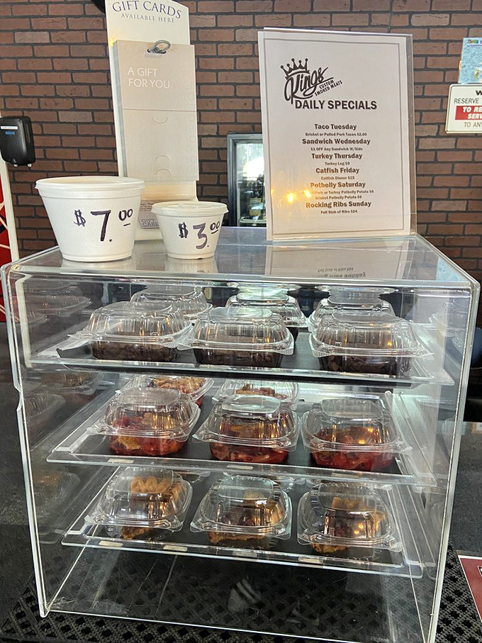 Daily desserts await behind glass like sweet treasures. Notice the daily specials board – Taco Tuesday is when barbecue gets a south-of-the-border twist.