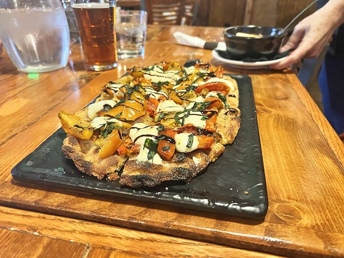 This flatbread is what happens when mountain air inspires culinary creativity. Fresh vegetables and melted cheese on a perfectly crisp crust—a handheld slice of heaven.