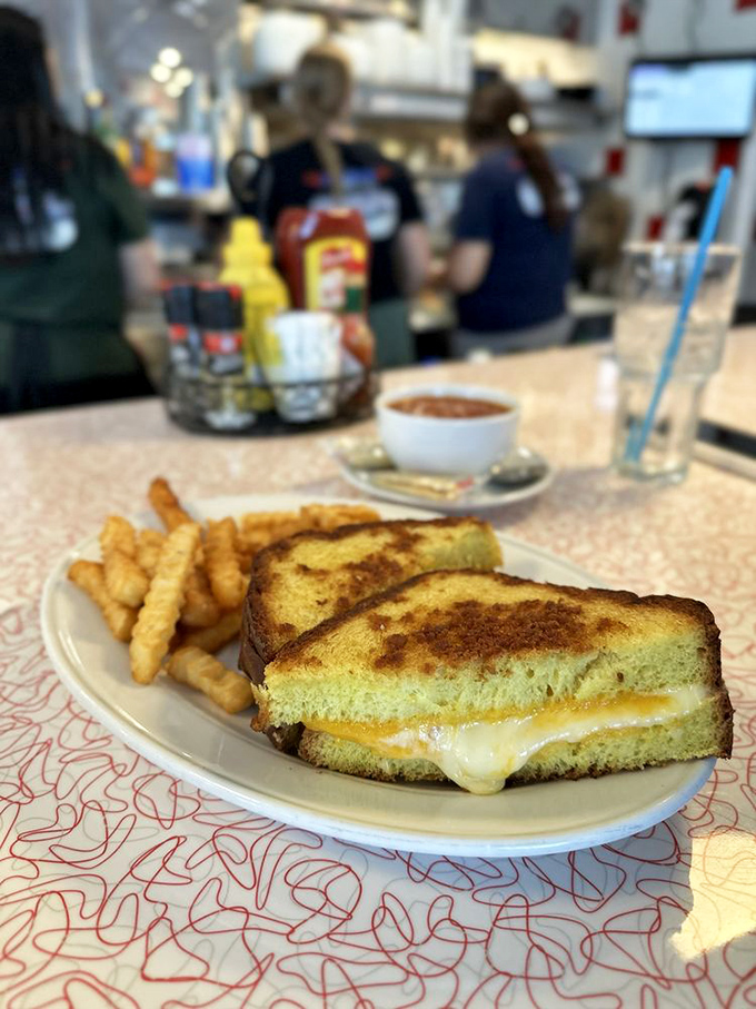 Behold the holy trinity of breakfast: perfectly crisped hash browns, scrambled eggs with just the right fluff factor, and bacon that shatters like caramel.