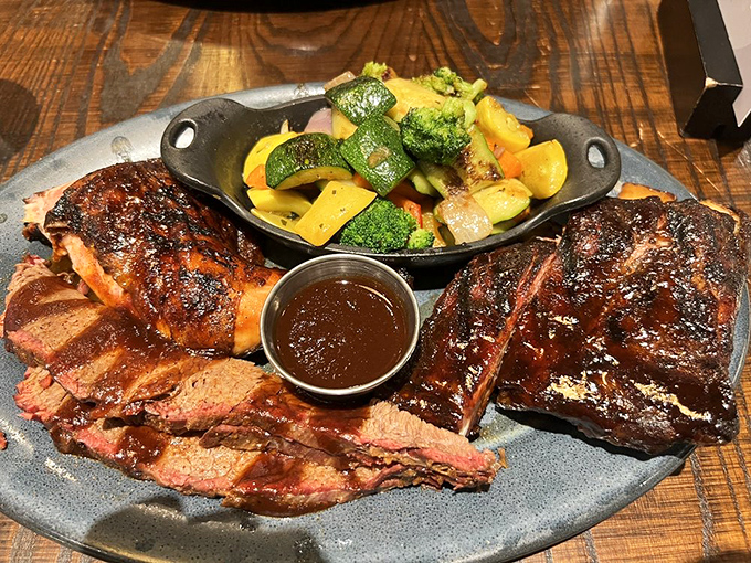 The Judge's Plate delivers the barbecue trifecta—ribs, brisket, and chicken with sides that don't merely complement but compete for your affection.