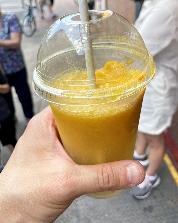Summer in a cup—this refreshing citrus limeade with a golden scoop of mango sorbet is basically sunshine you can drink.