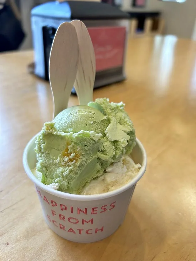 Pale green scoops nestled in a cup declaring "Happiness From Scratch." Truth in advertising has never tasted so good.