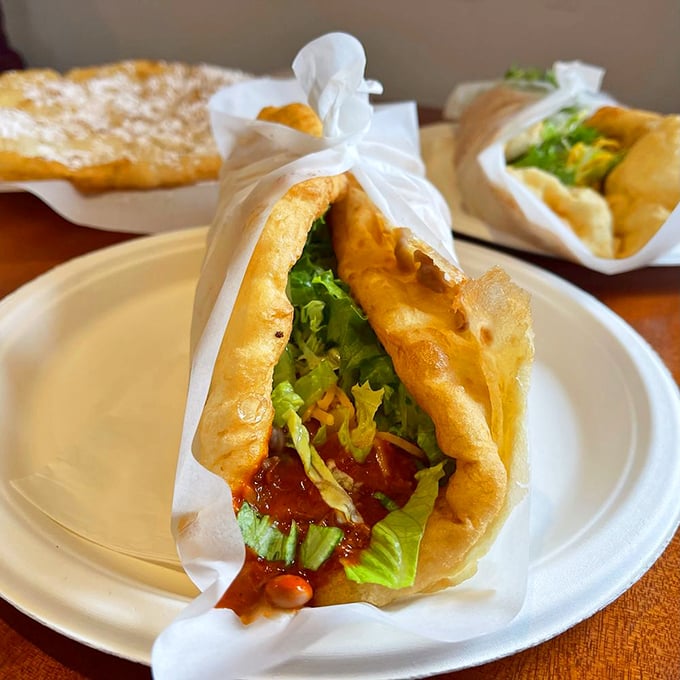 The ultimate open-faced taco experience. Beans, meat, and fresh veggies nestled in a golden fry bread cradle—a delicious edible bowl of Southwestern joy.