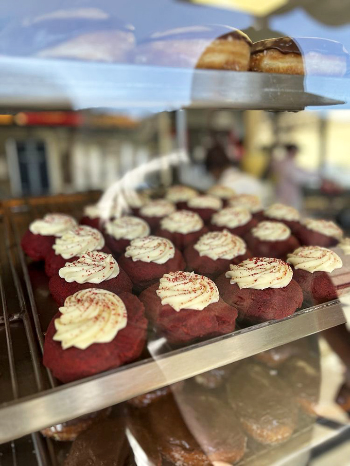Red velvet beauties topped with cream cheese frosting—like tiny edible pillows designed for your taste buds, not your head.