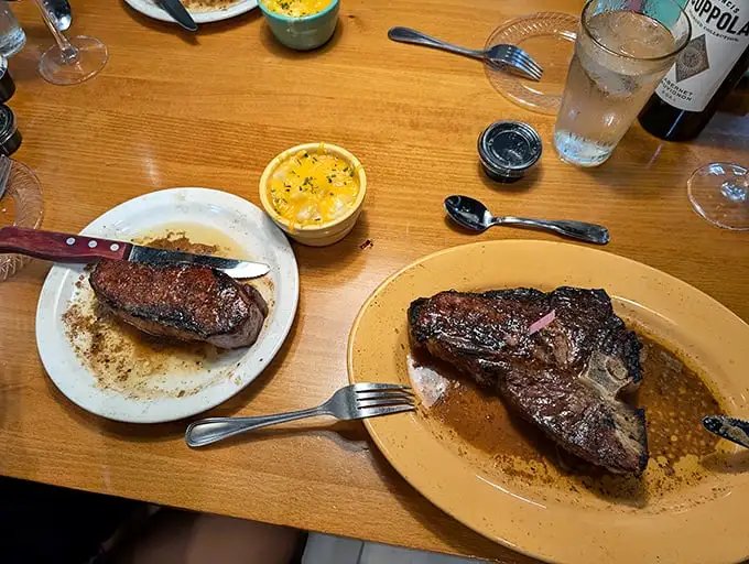 Two steaks, one plate, zero complaints. The pink toothpick isn't just for show—it's a tiny flag planted on the summit of Flavor Mountain.